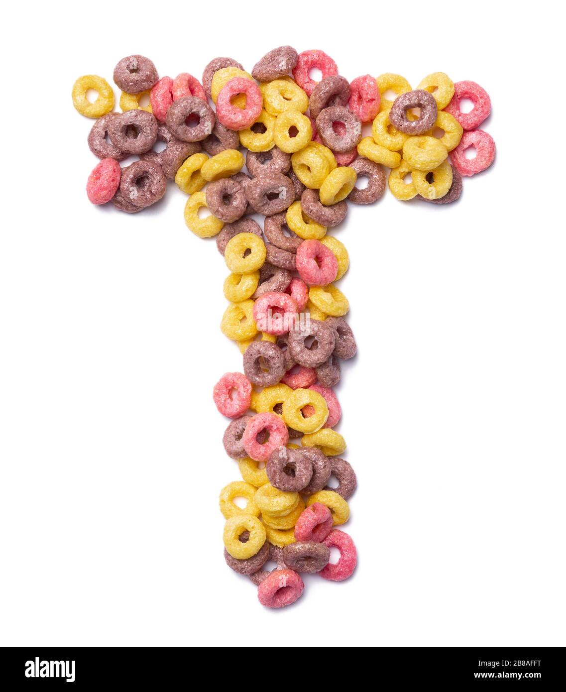 Letter T of the English alphabet from pink colored flakes on a white ...