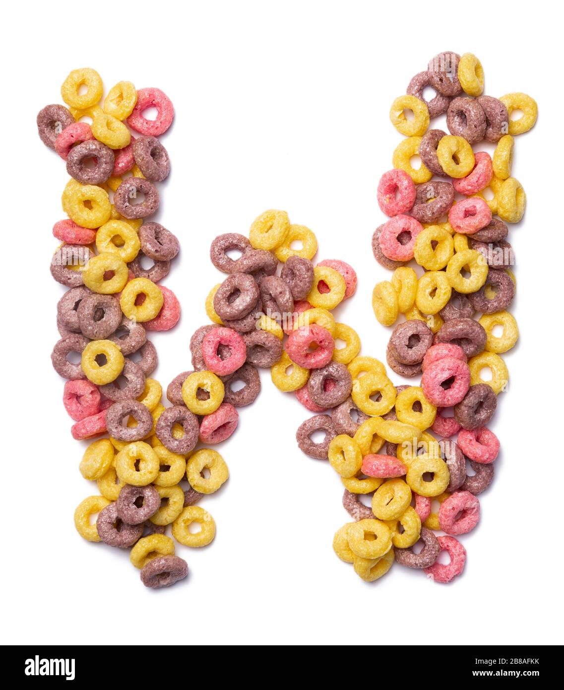 Letter W of the English alphabet from pink colored flakes on a white ...