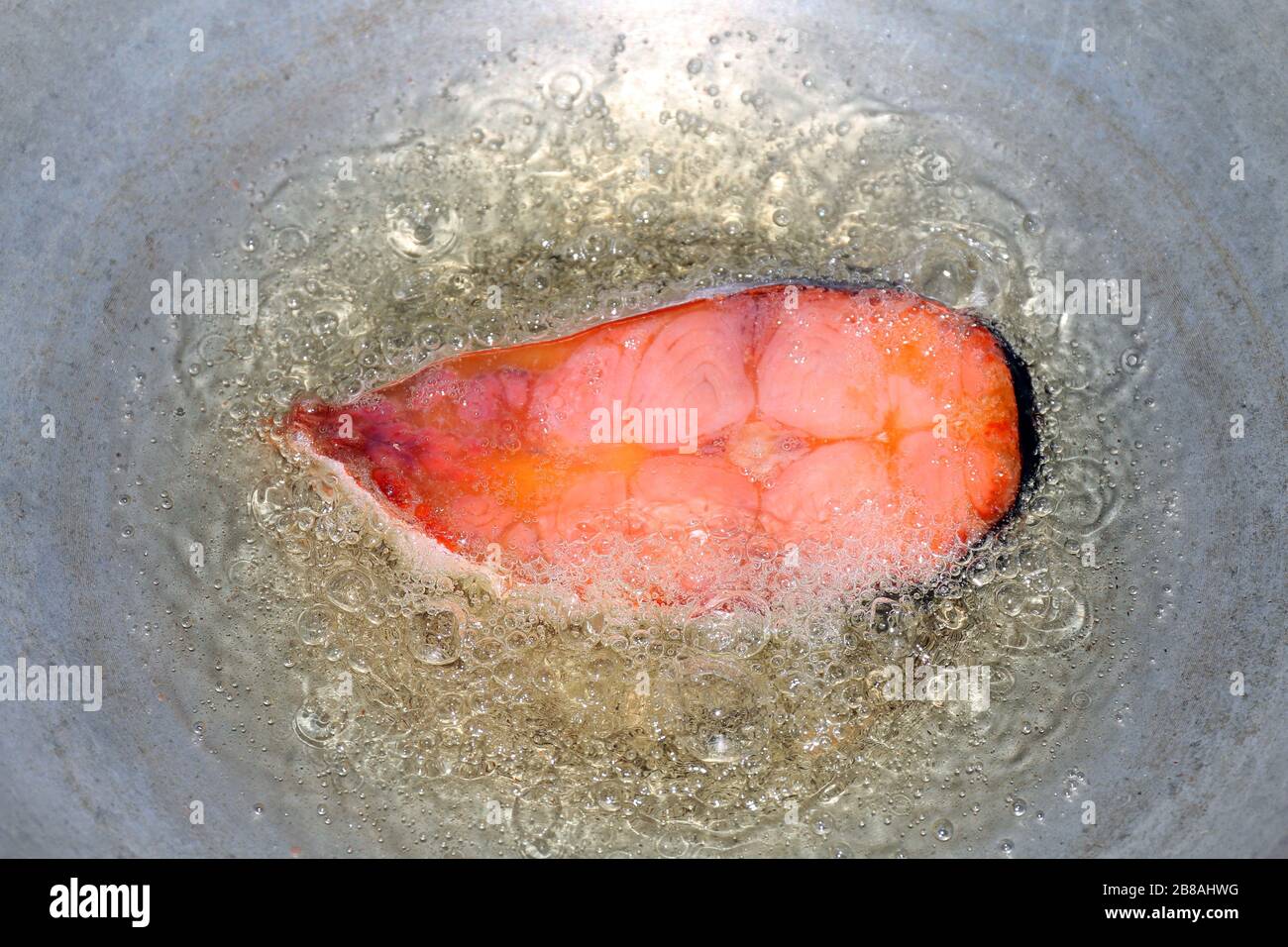 Fish raw slice piece cooking, Fried fish pieces in hot oil pan, Fried ...