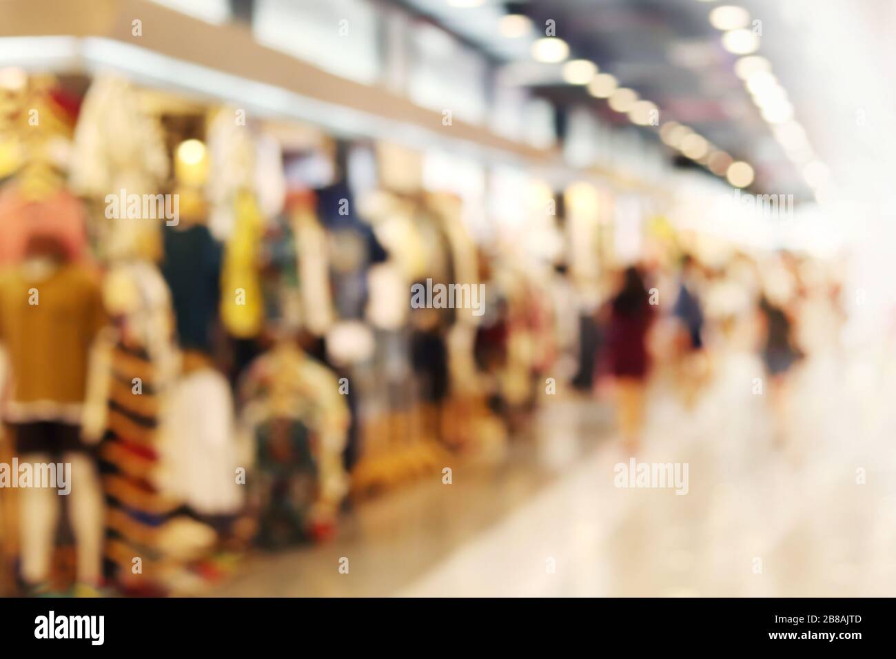 Blurred picture of Clothing store fashion shop inside shopping mall ...