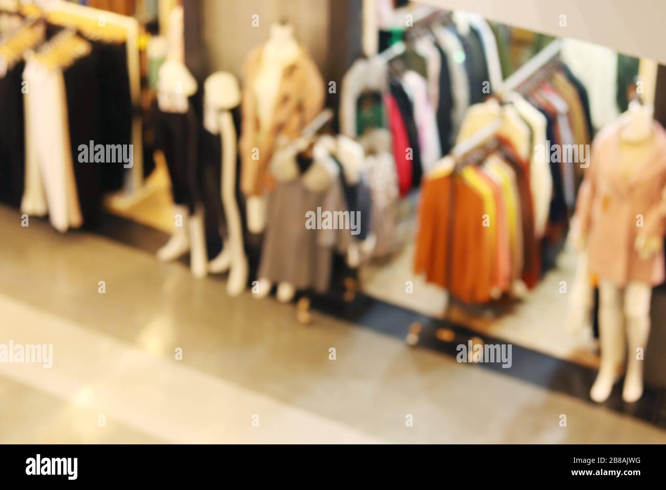 Blurred picture of Clothing store fashion shop inside shopping mall ...