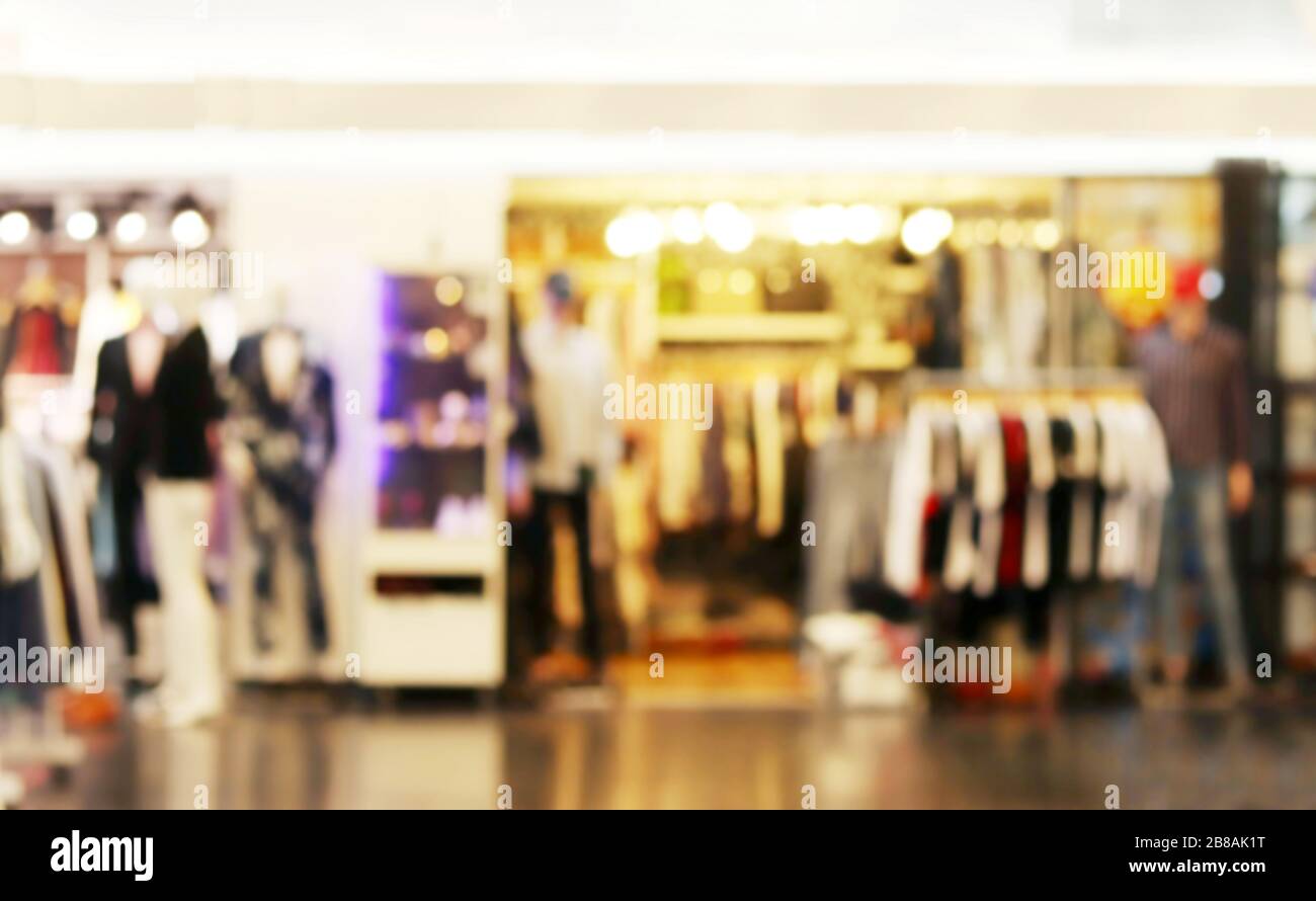 Blurred picture of Clothing store fashion shop inside shopping mall ...