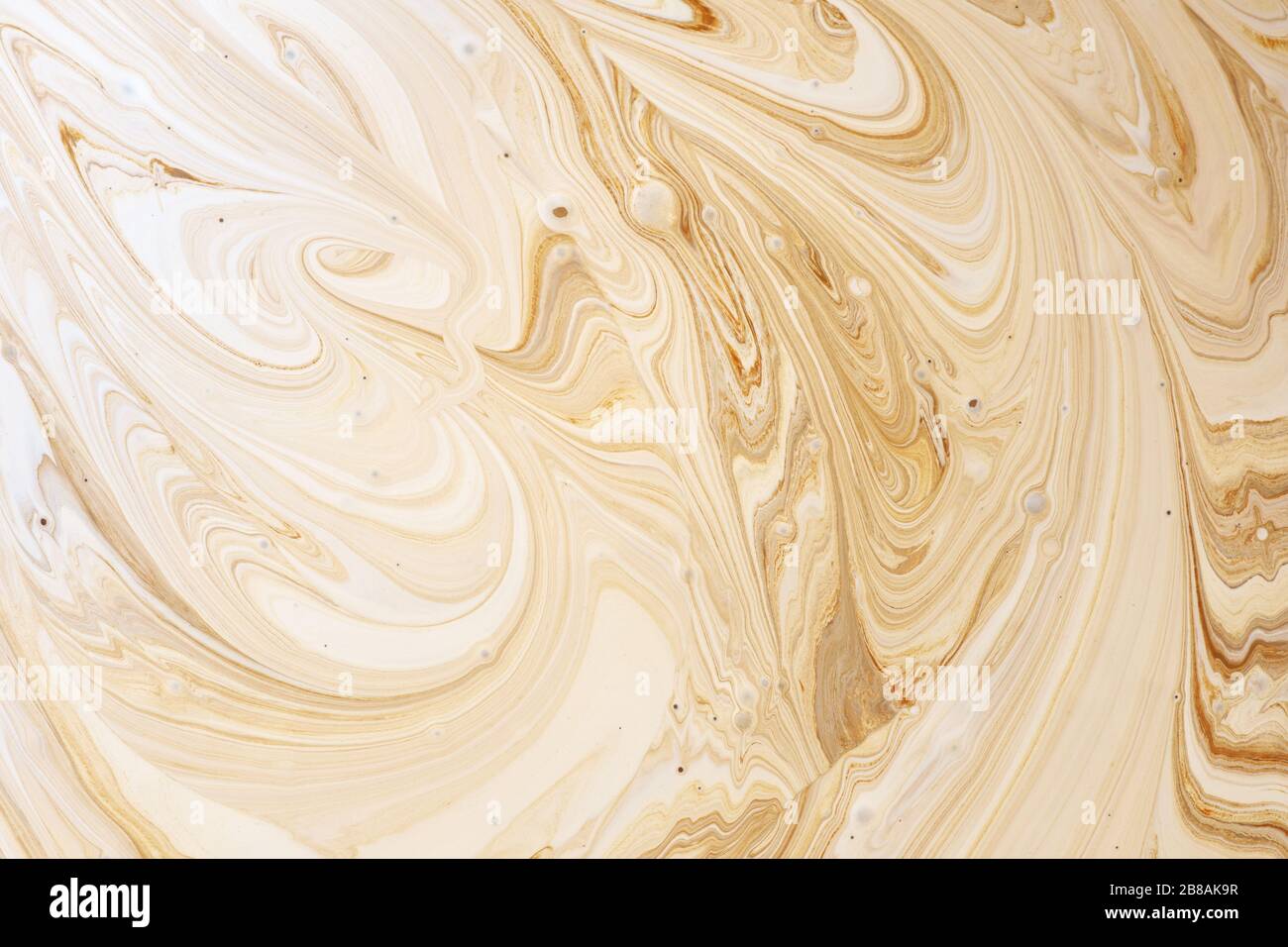 Close-up abstract caramel shapes latte art in coffee. Liquid texture ...