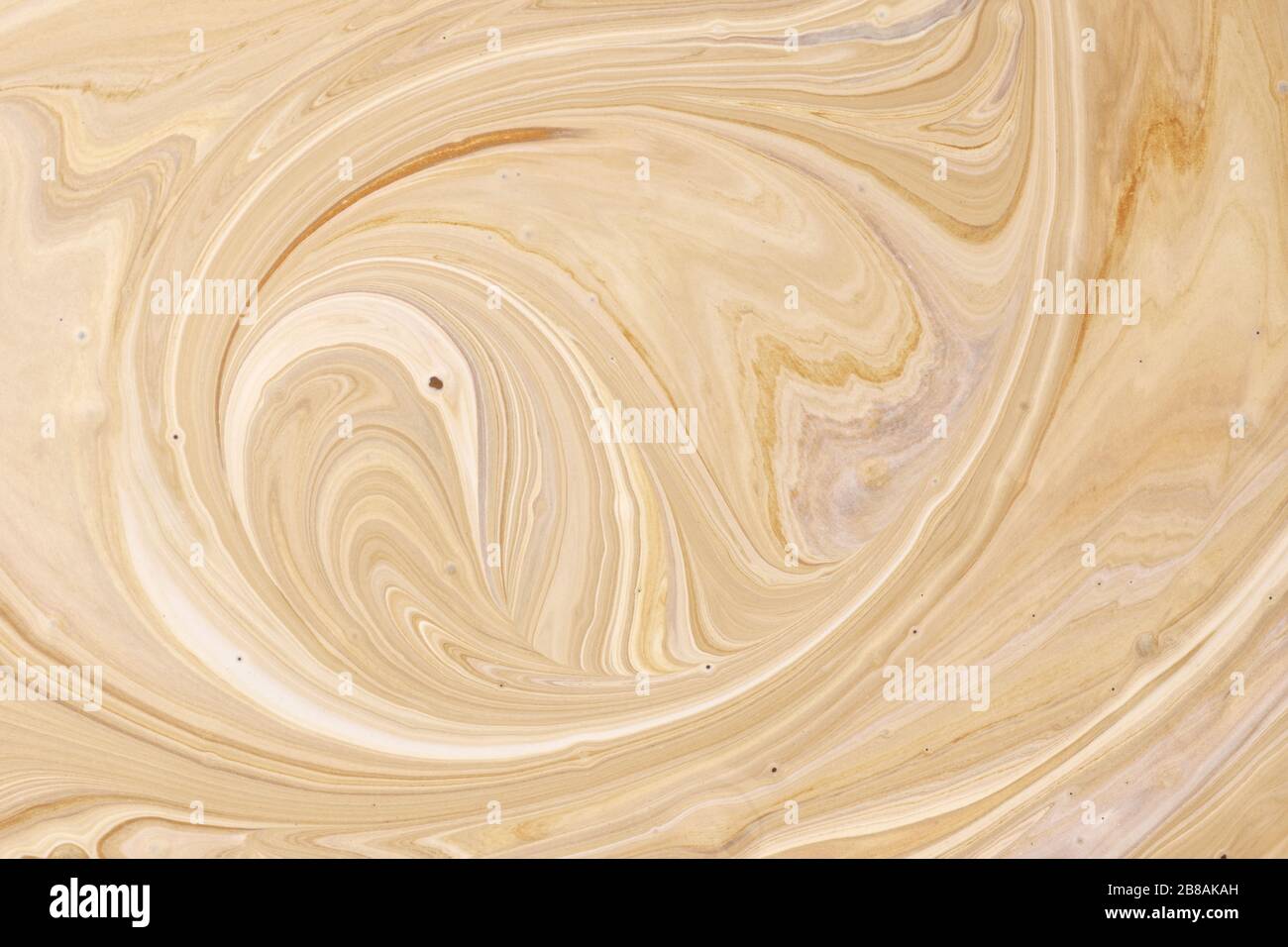 Close-up abstract caramel shapes latte art in coffee. Liquid texture ...