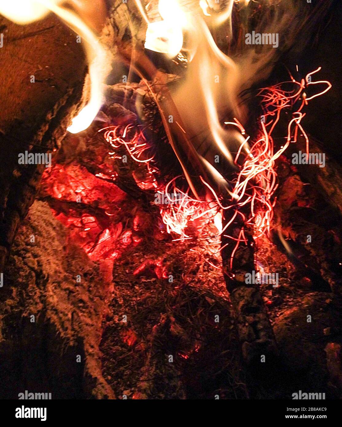 fire created by the fathoms of a camp with much red Stock Photo - Alamy