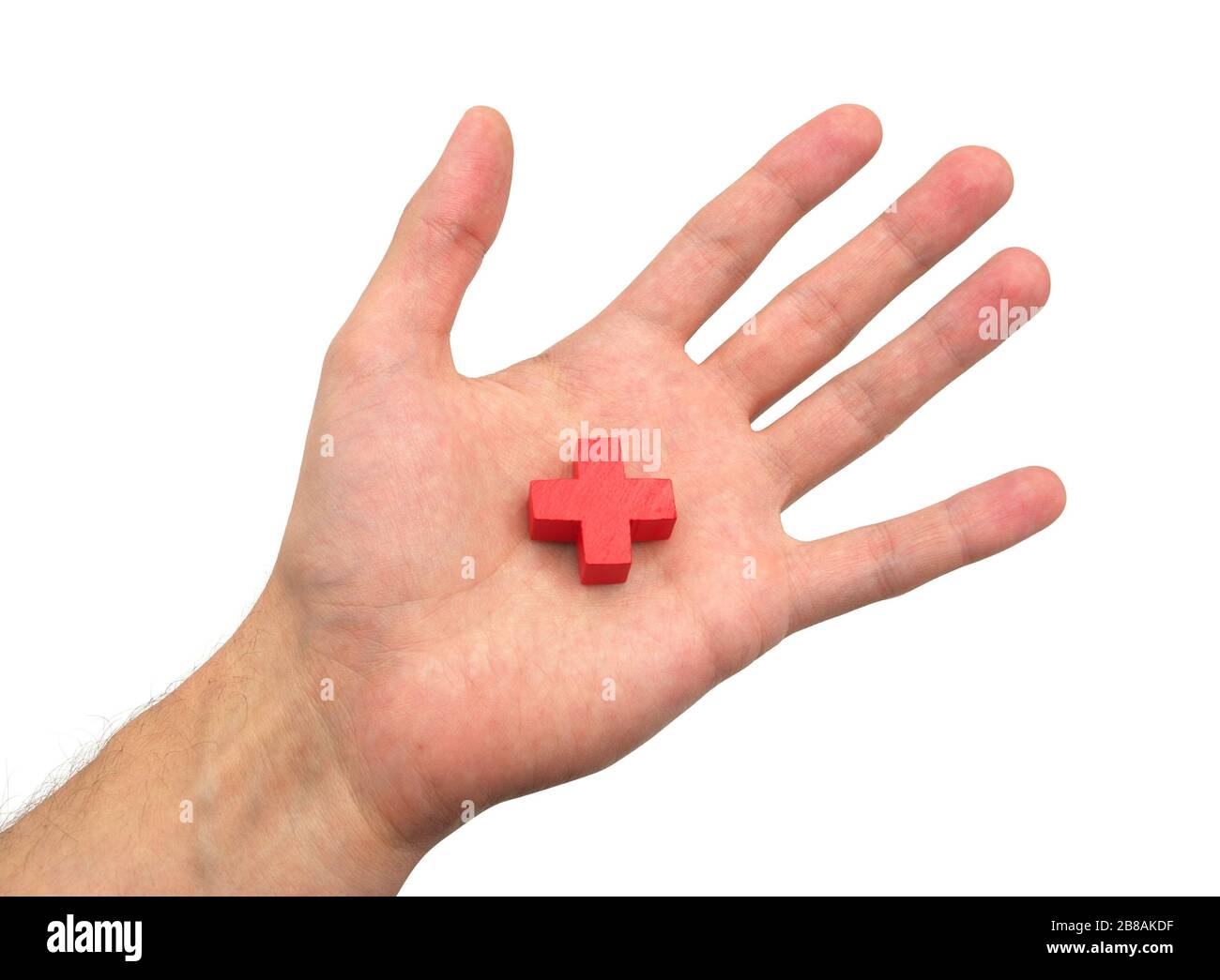 Medical red cross in hand. Element of design Stock Photo - Alamy