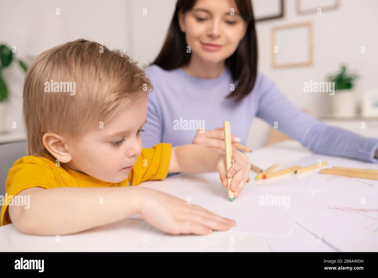 Boy sitting desk coloring hi-res stock photography and images - Alamy