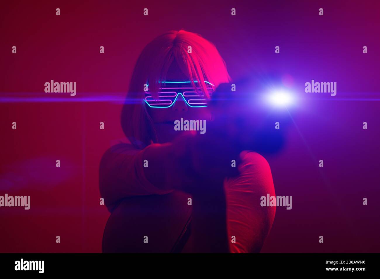 Girl with blaster in the futuristic battle. Concept virtual reality ...