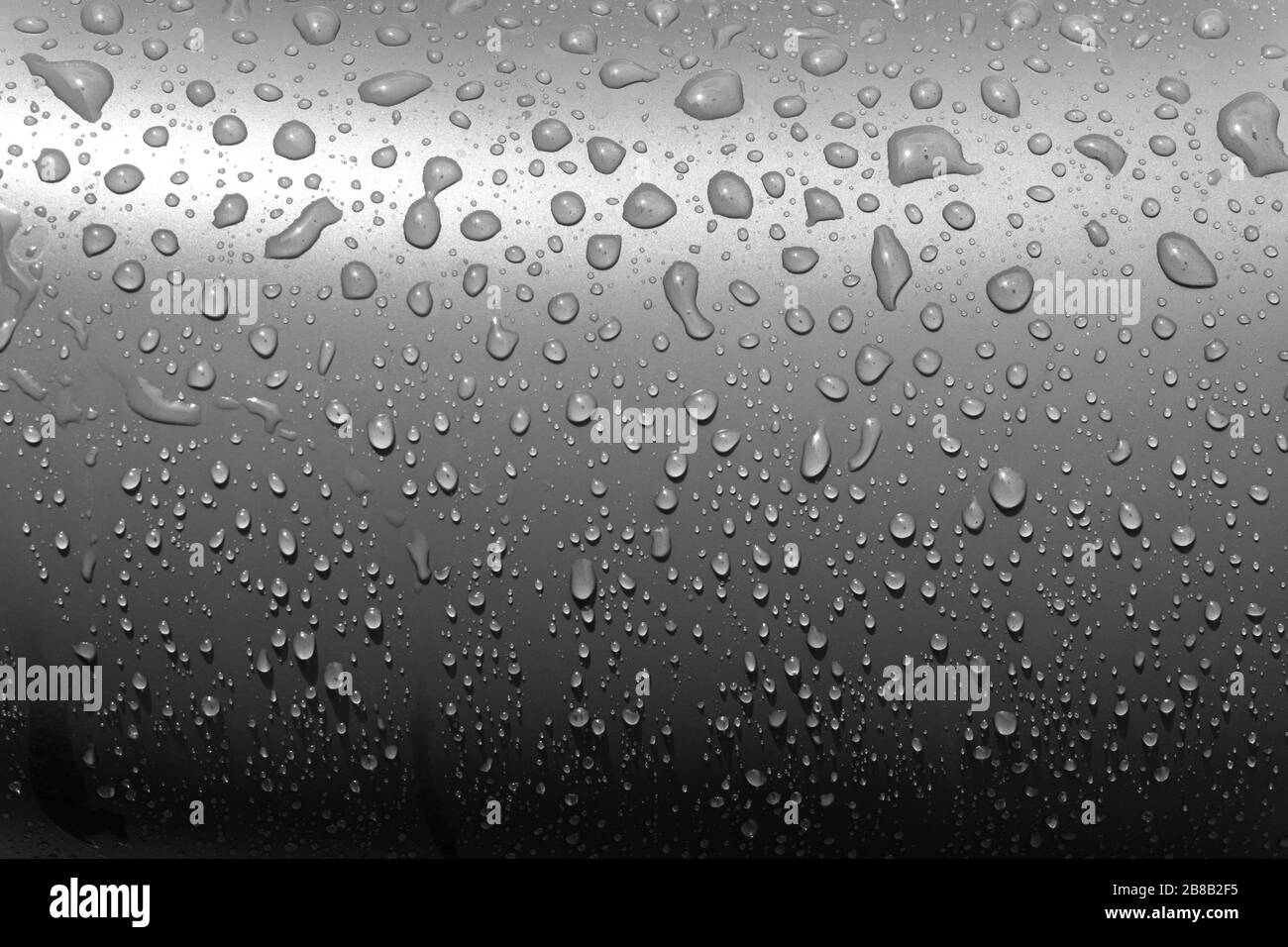 Grey surface covered with raindrops - great for a dramatic background ...
