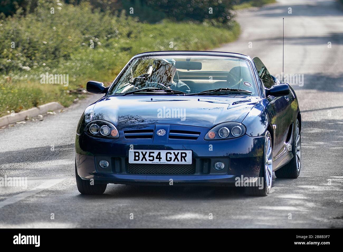 Sports car driving road hi-res stock photography and images - Alamy