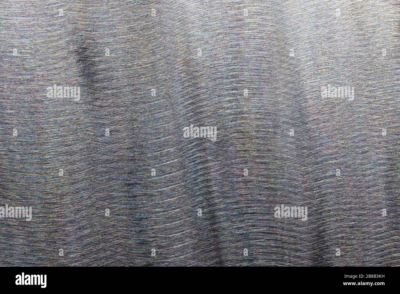 Close-up texture of flat steel surface manually cleaned with a flap ...