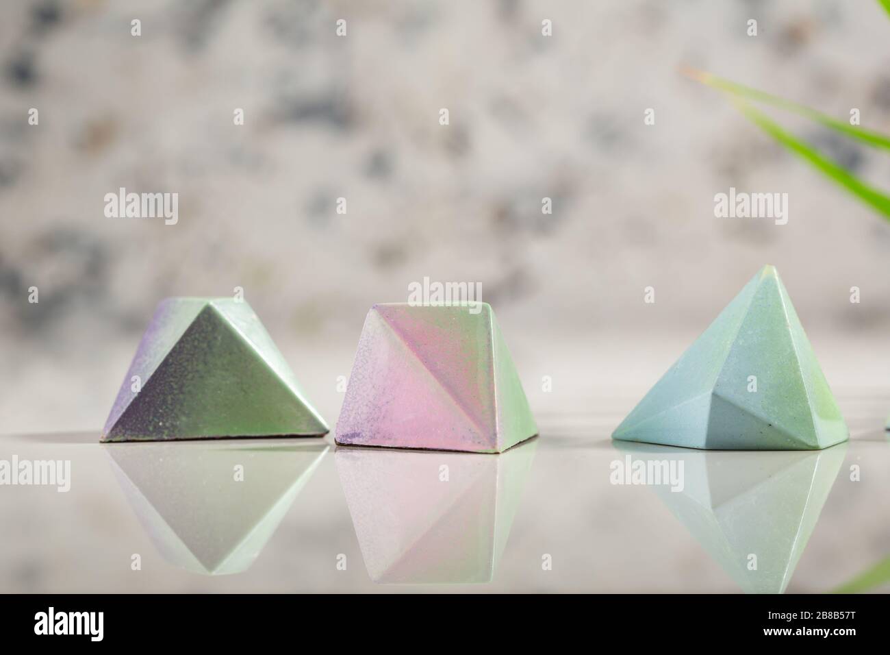 Modern chocolate candies pastel colour Stock Photo - Alamy