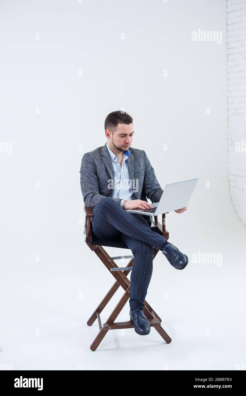 Male teacher director businessman sitting on a chair studying documents ...
