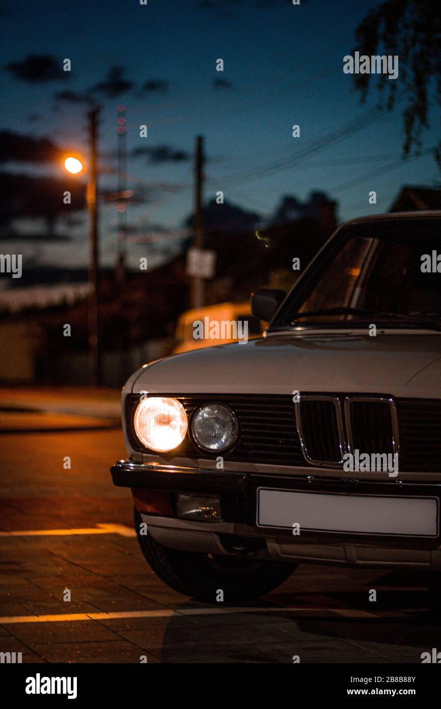 Beautiful shot of a white vintage classic car with round headlights in ...