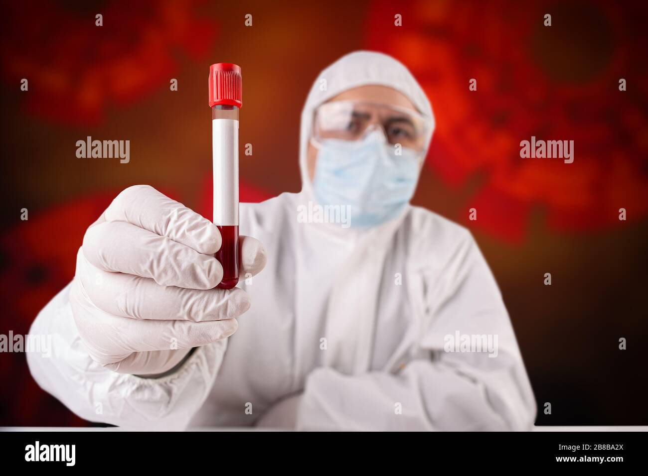 Scientist holding test tube with blood sample against red background ...