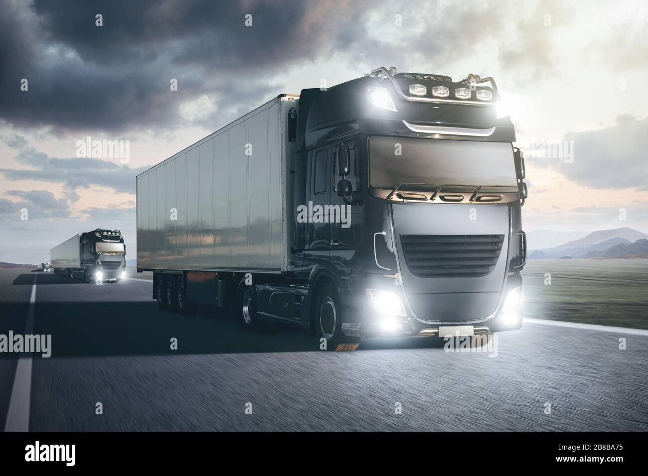 Trucks with trailers driving on a highway Stock Photo - Alamy
