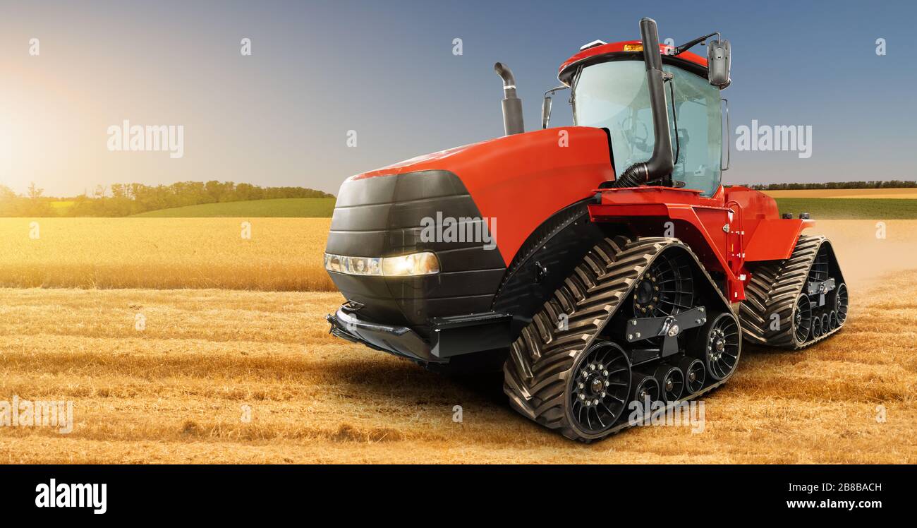Red rubber tracked agricultural tractor Stock Photo - Alamy
