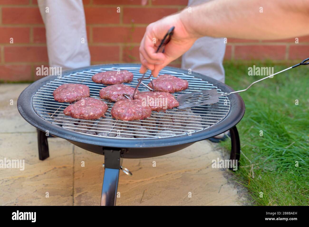 bbq grill handmade burgers cooking on hot charcoal in backyard in ...