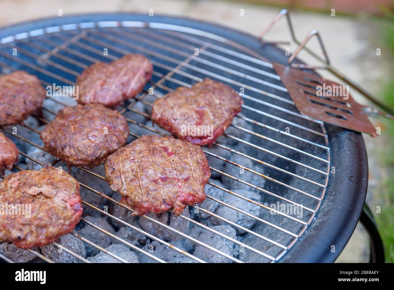 bbq grill handmade burgers cooking on hot charcoal in backyard in ...
