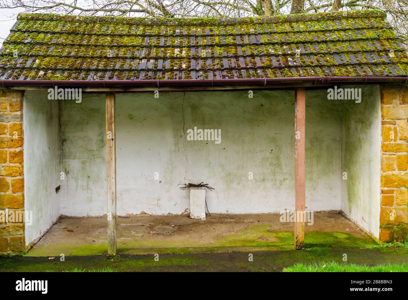 vintage bus stop shelter in village in england uk Stock Photo - Alamy