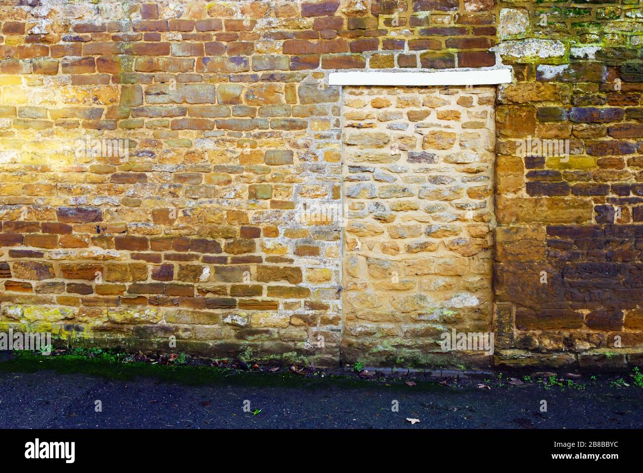 old door stone wall building texture in england uk Stock Photo - Alamy