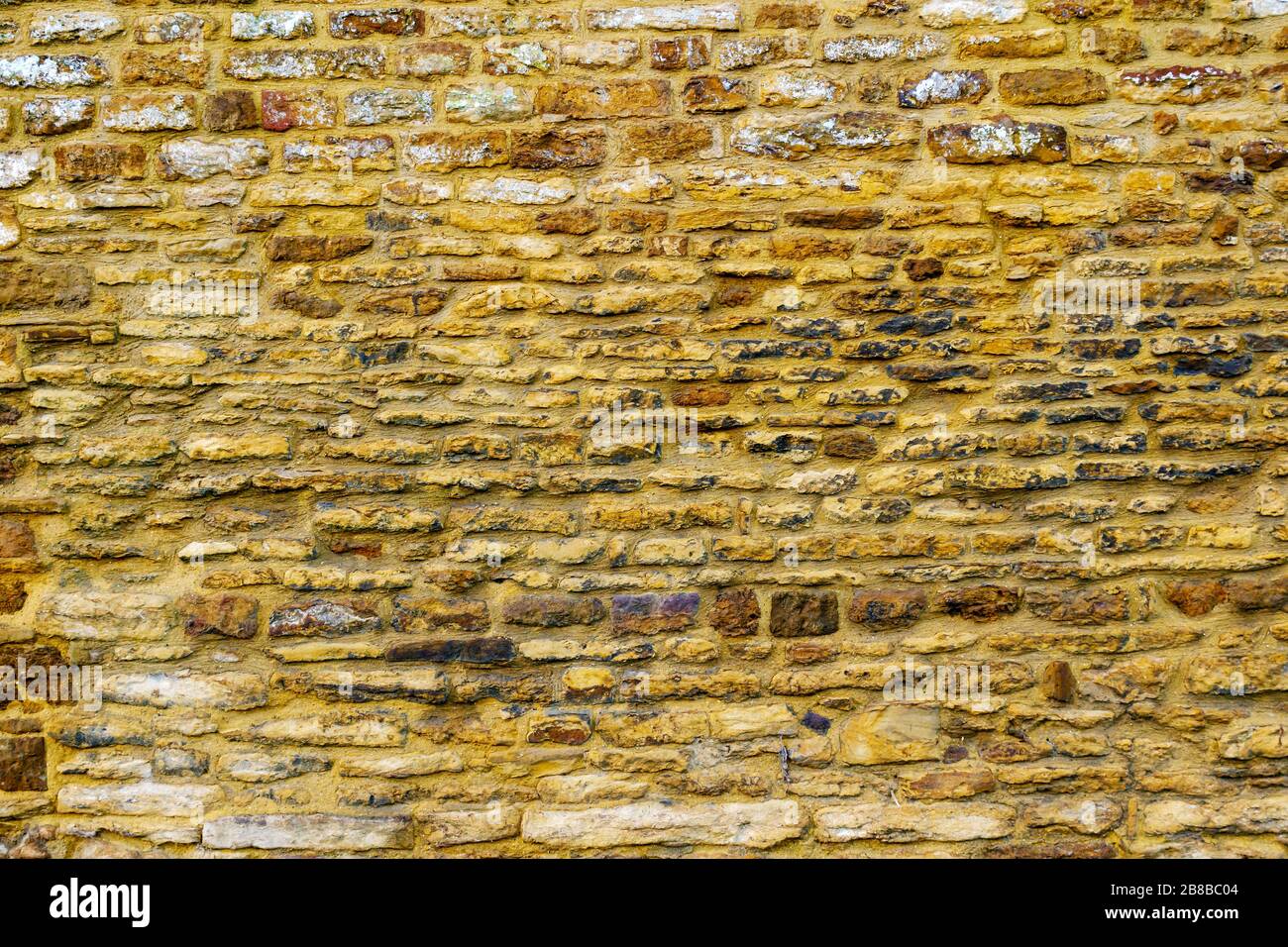 old stone wall building texture in england uk Stock Photo - Alamy