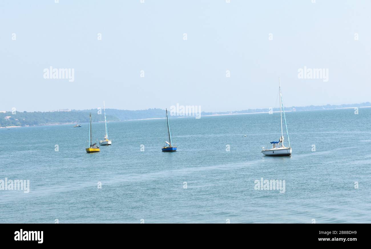 sailing boats in the blue ocean in goa Stock Photo - Alamy
