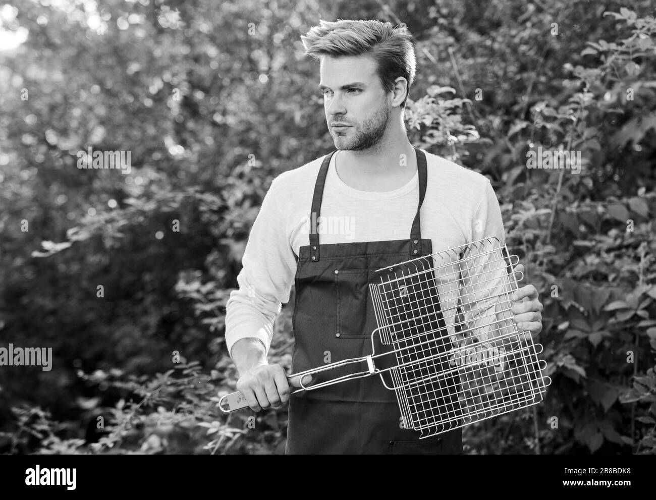 Picnic concept. Man hold grilling grid. Grilling food. Backyard ...