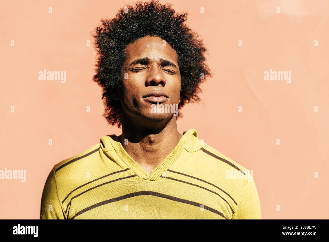 Cuban black man enjoying the andalusian sun with his eyes closed Stock ...