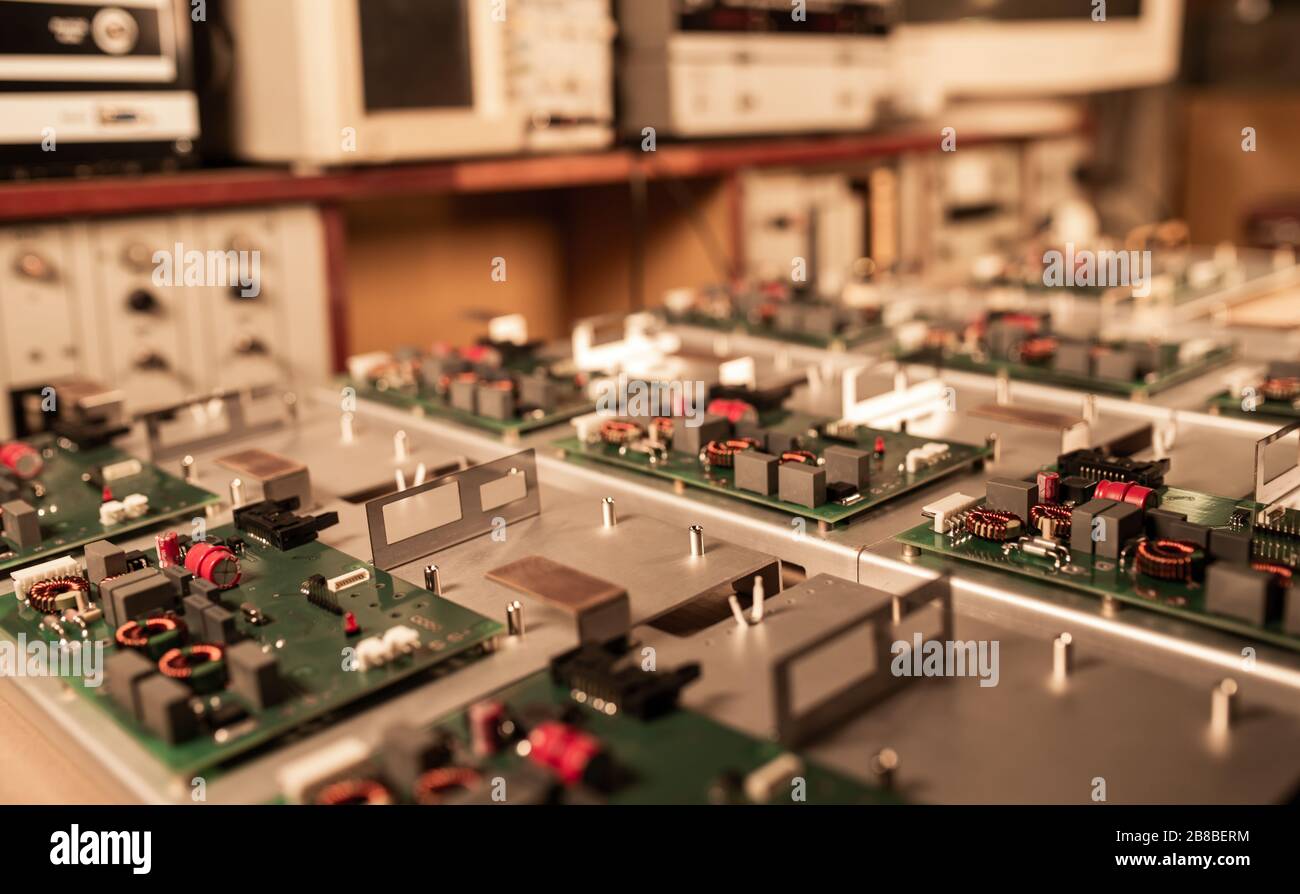 Microcircuits and components lie on metal plates during the production ...