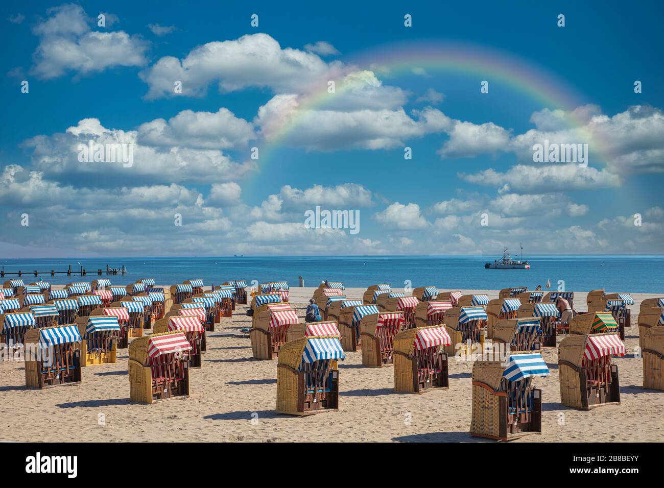 a panoramic photo of colorful beach chairs on the beach in beautiful ...