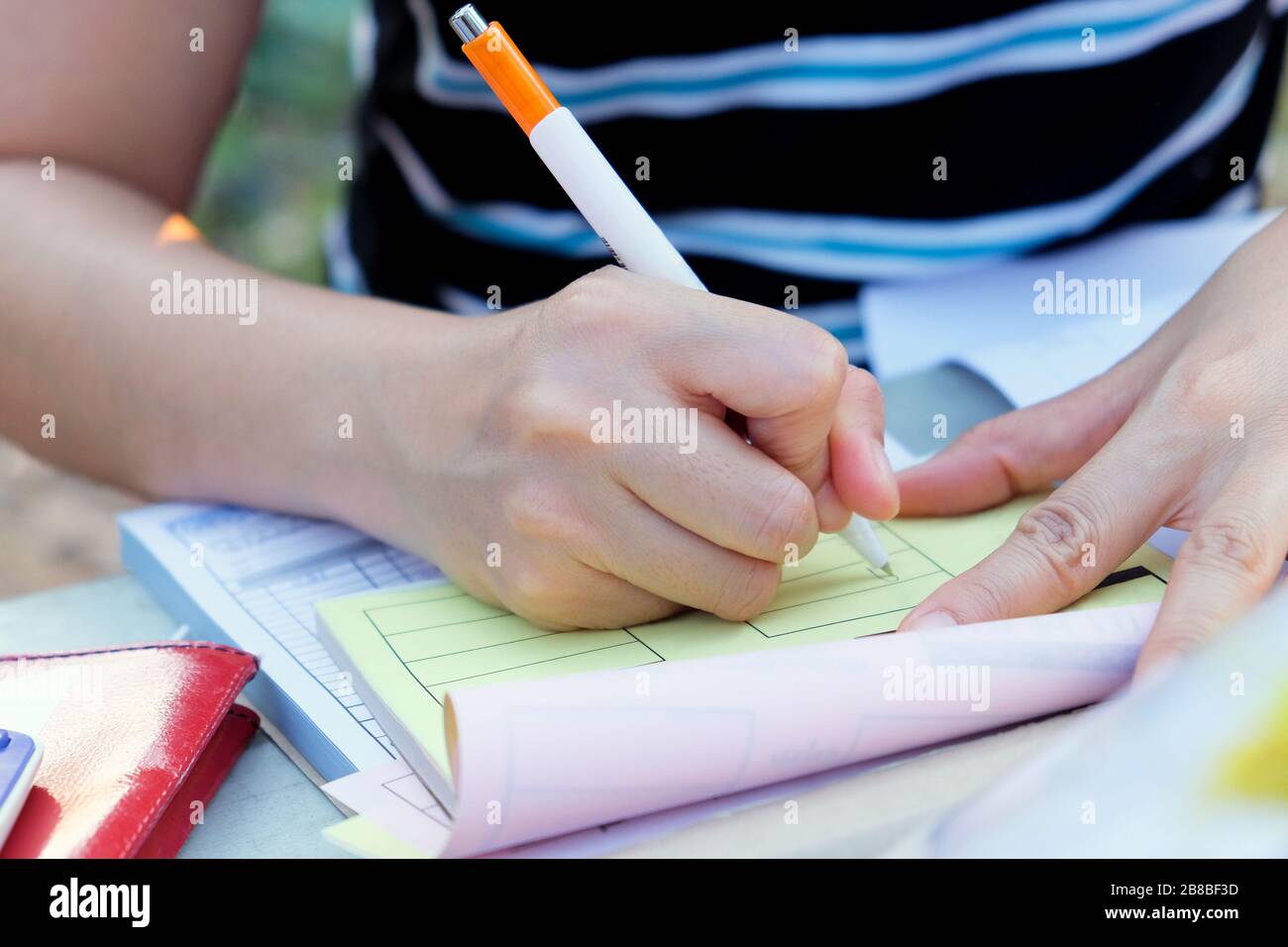 Close up female hands of accountant with calculator and pen. business ...