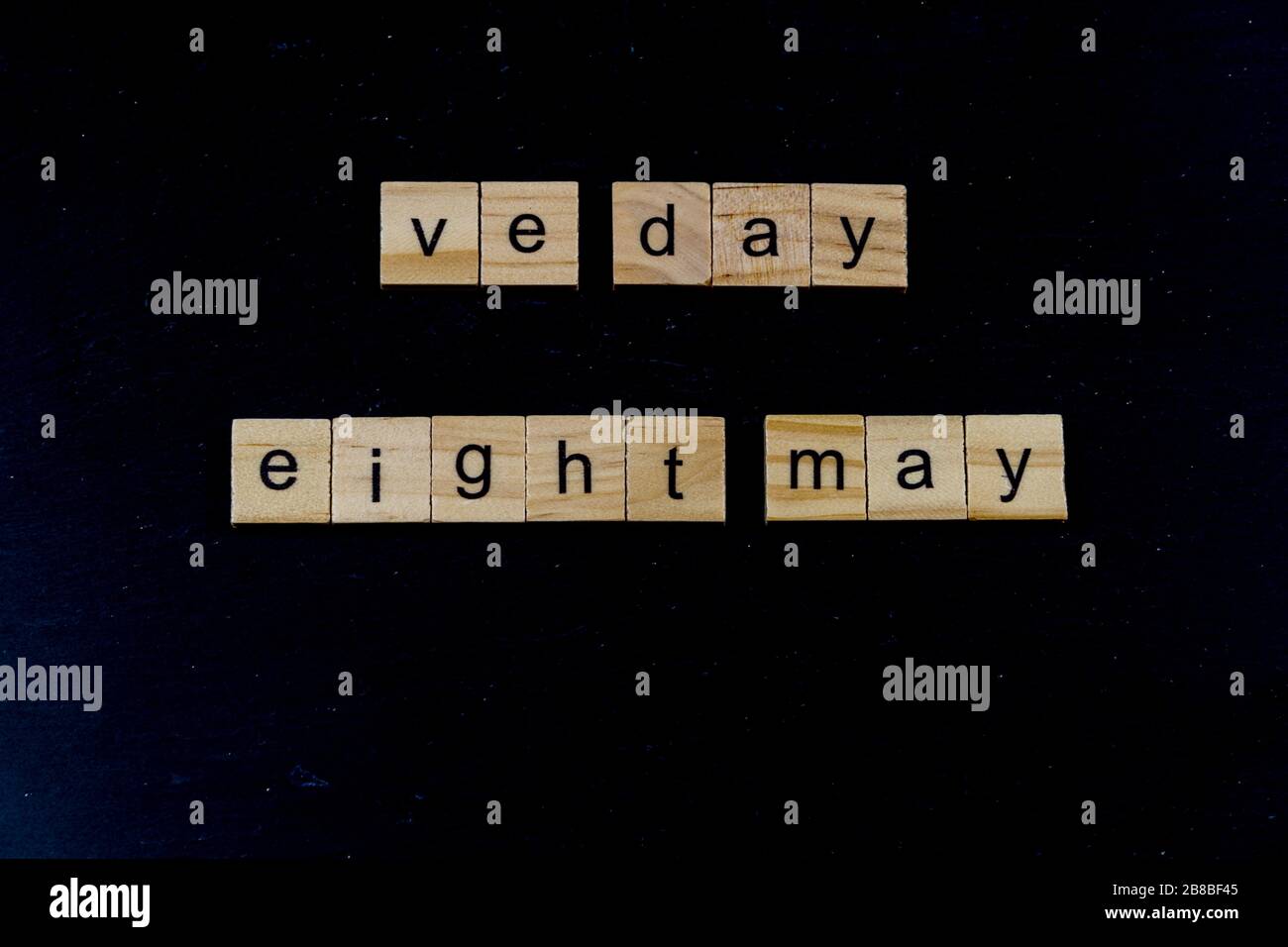 Children wood blocks lettering VE Day 2020 on black background Stock ...