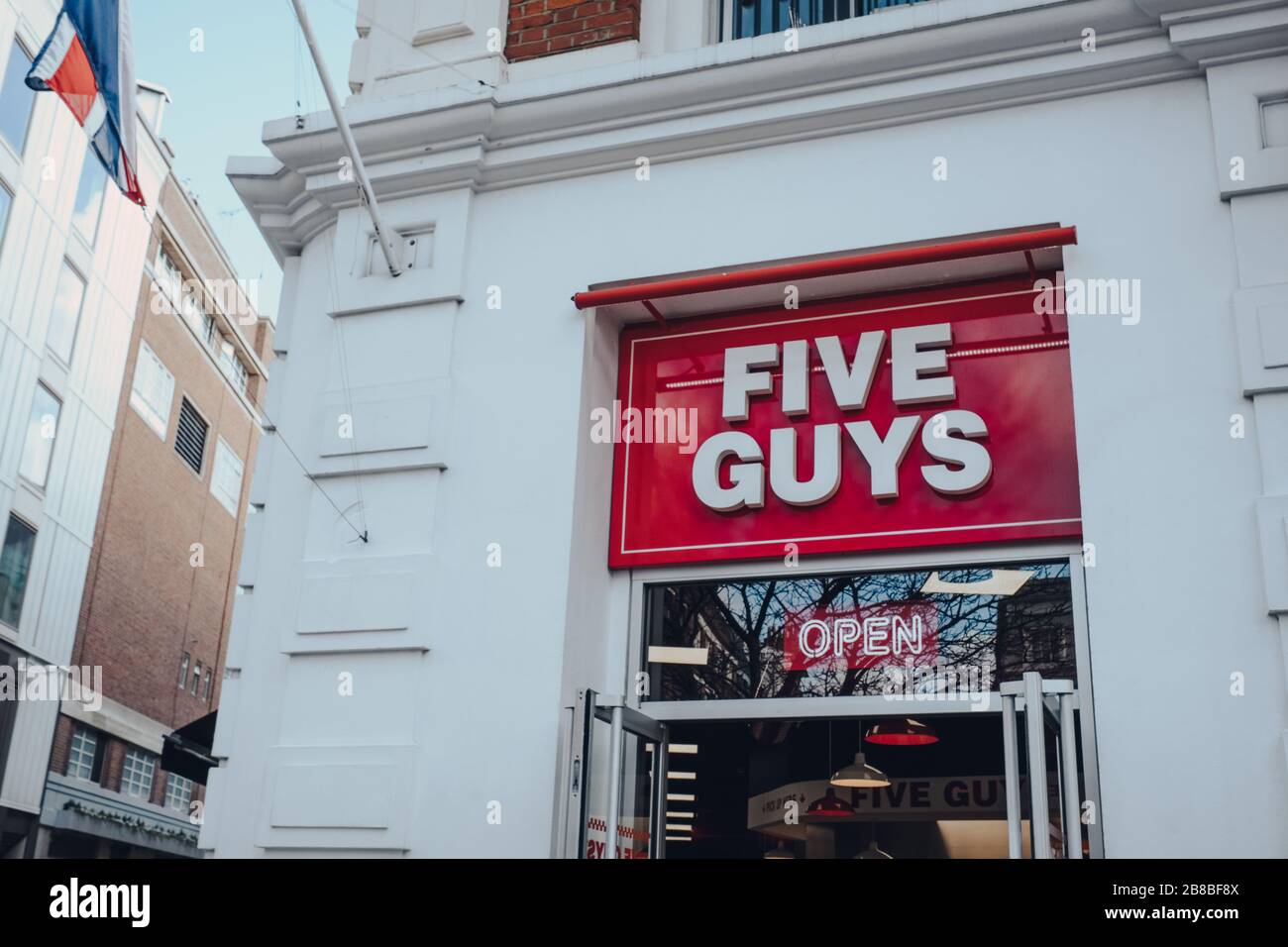 London, UK - March 06, 2020: Sign by the entrance to Five Guys ...