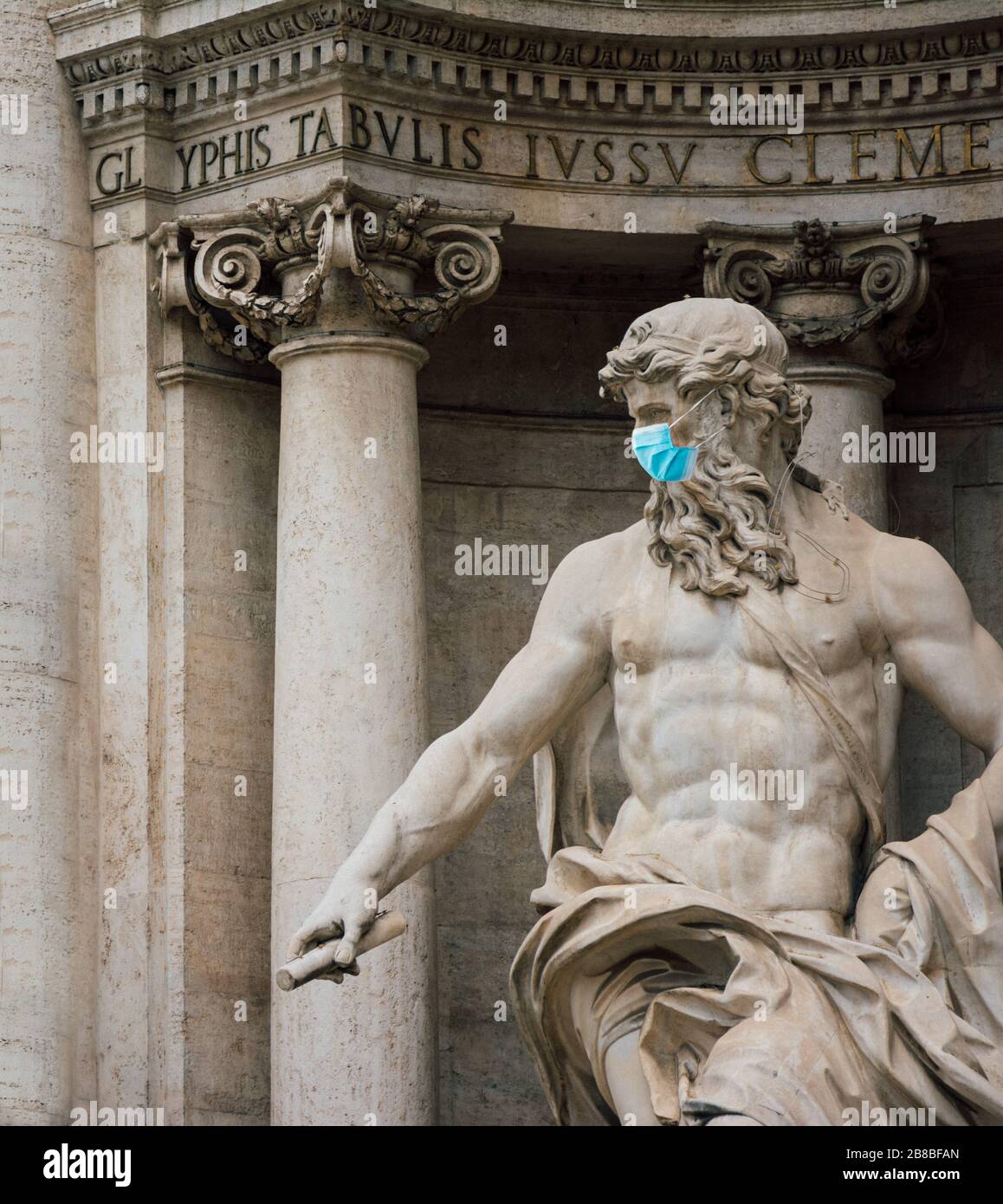 Neptune statue at the trevi fountain with a surgical mask Stock Photo ...