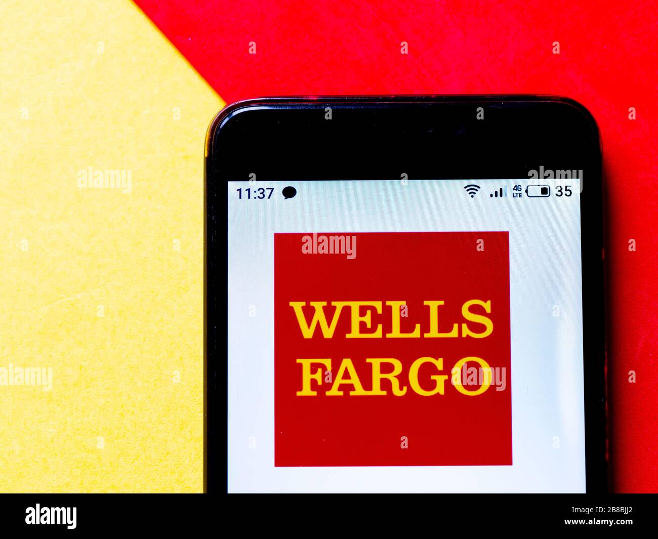 In this photo illustration Wells Fargo & Company logo is seen displayed ...