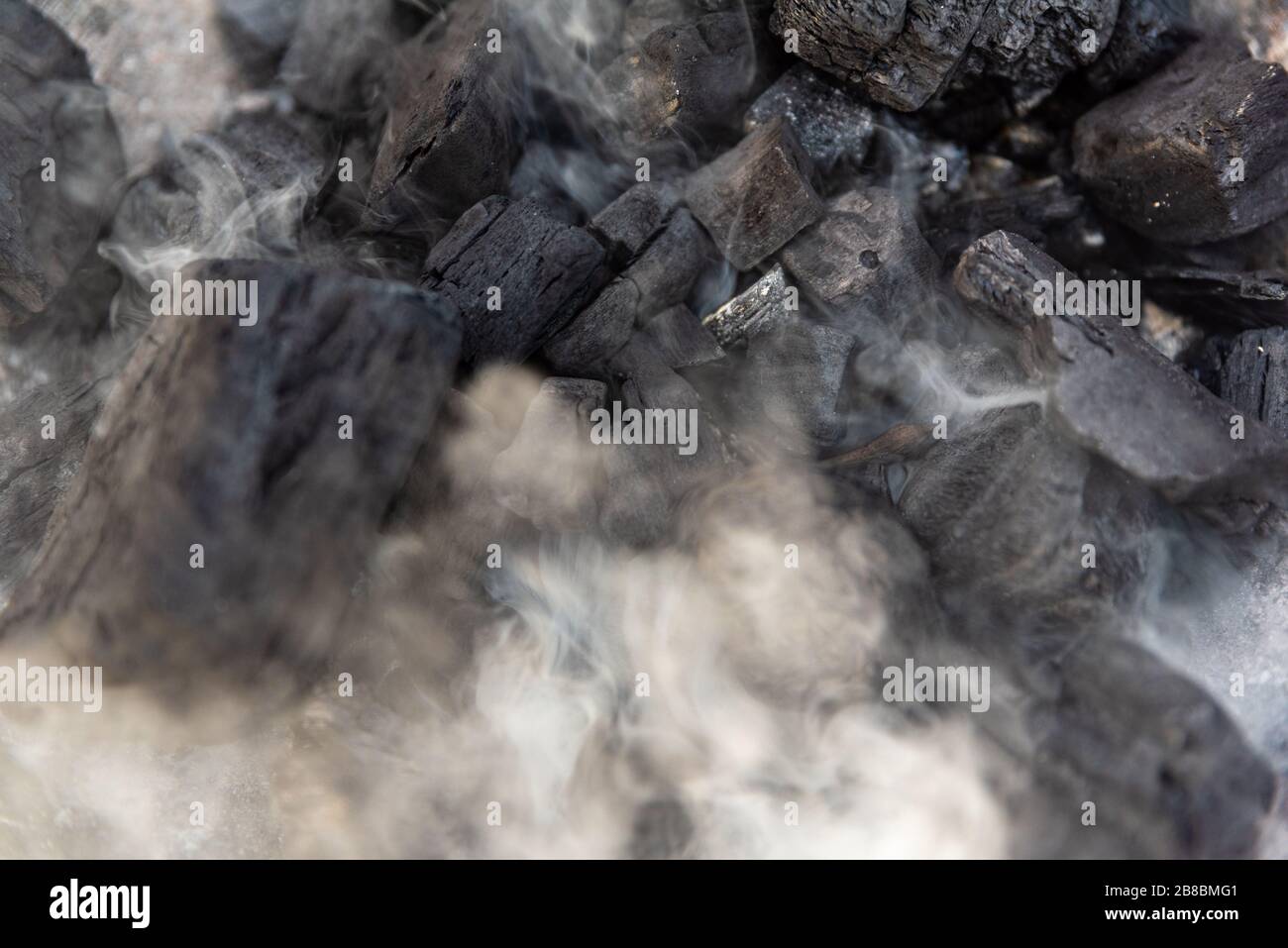 Coal in a cloud of smoke. Coal heating and environmental protection ...