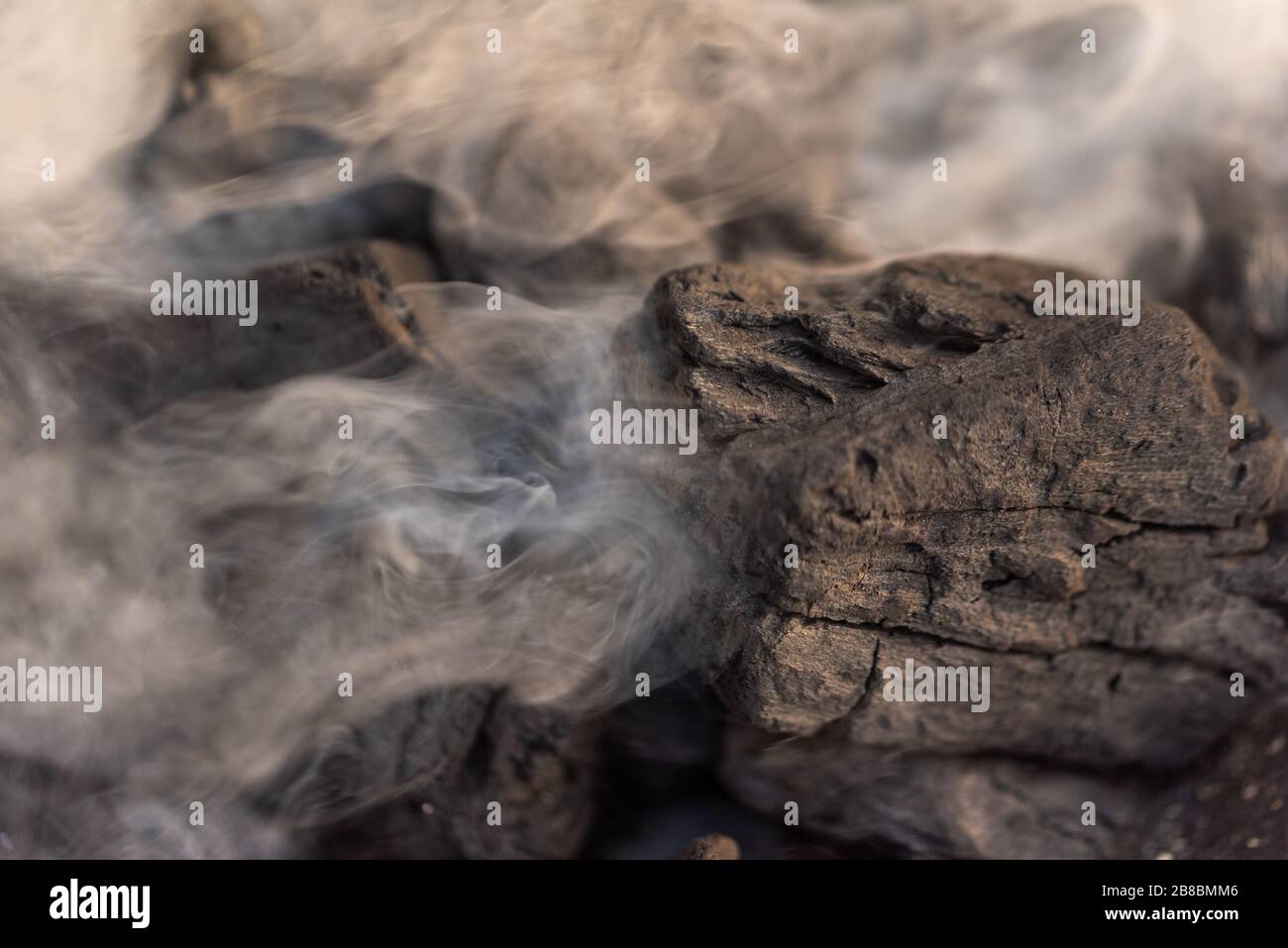 Coal in a cloud of smoke. Coal heating and environmental protection ...