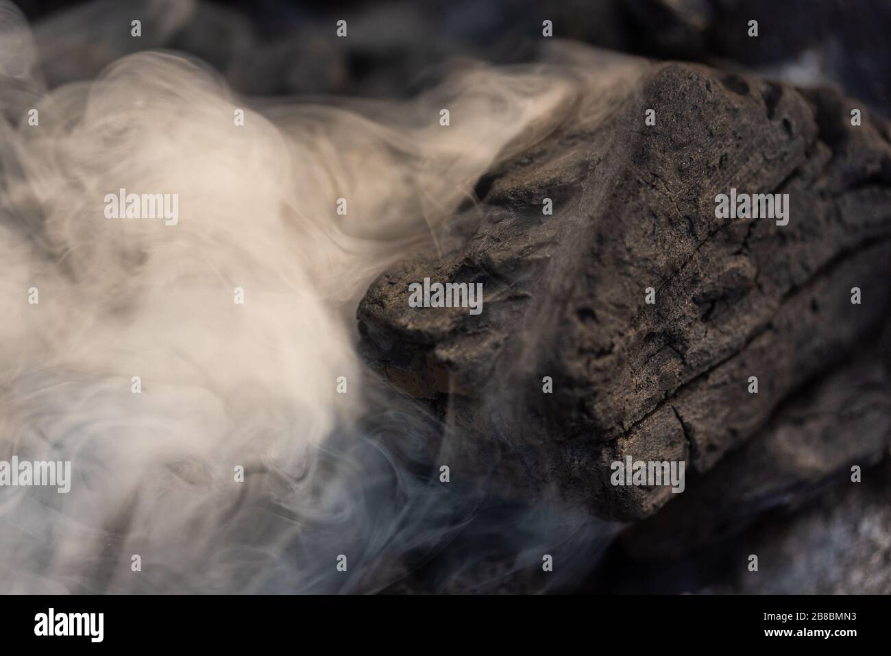 Coal in a cloud of smoke. Coal heating and environmental protection ...