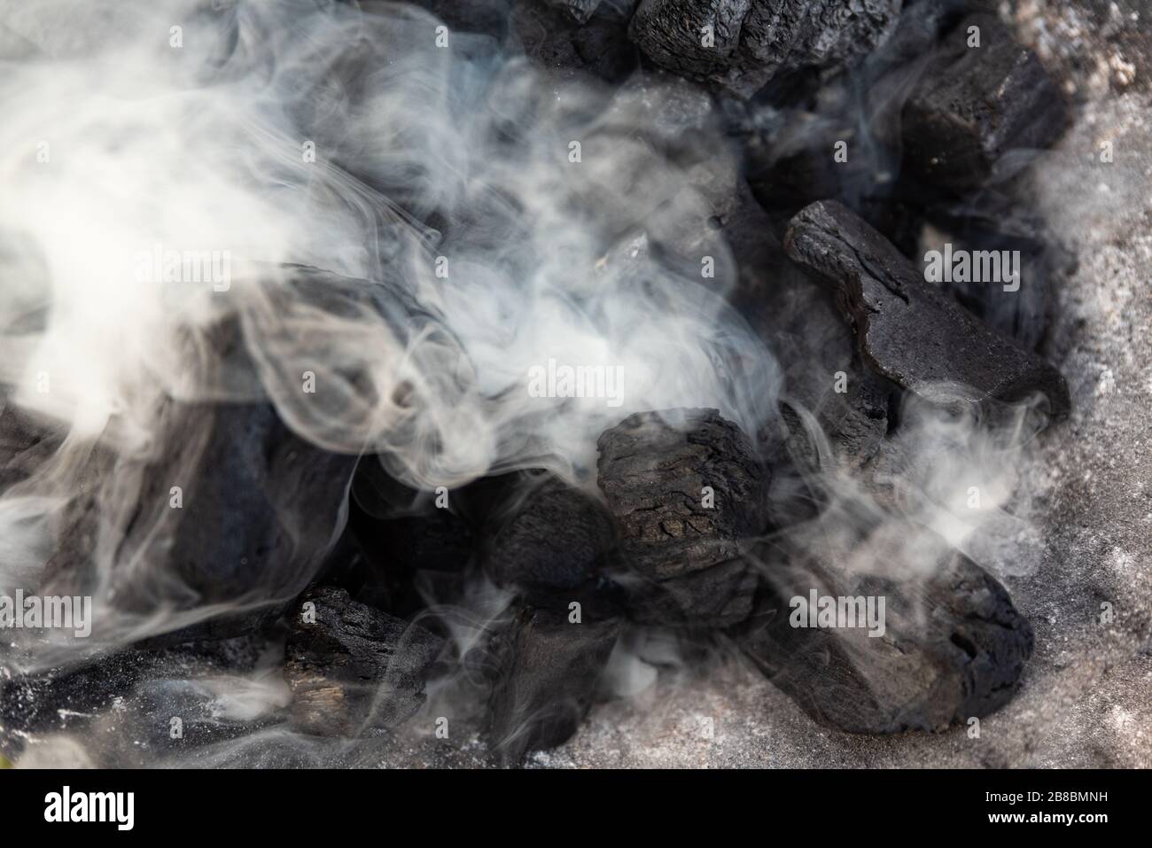 Coal in a cloud of smoke. Coal heating and environmental protection ...