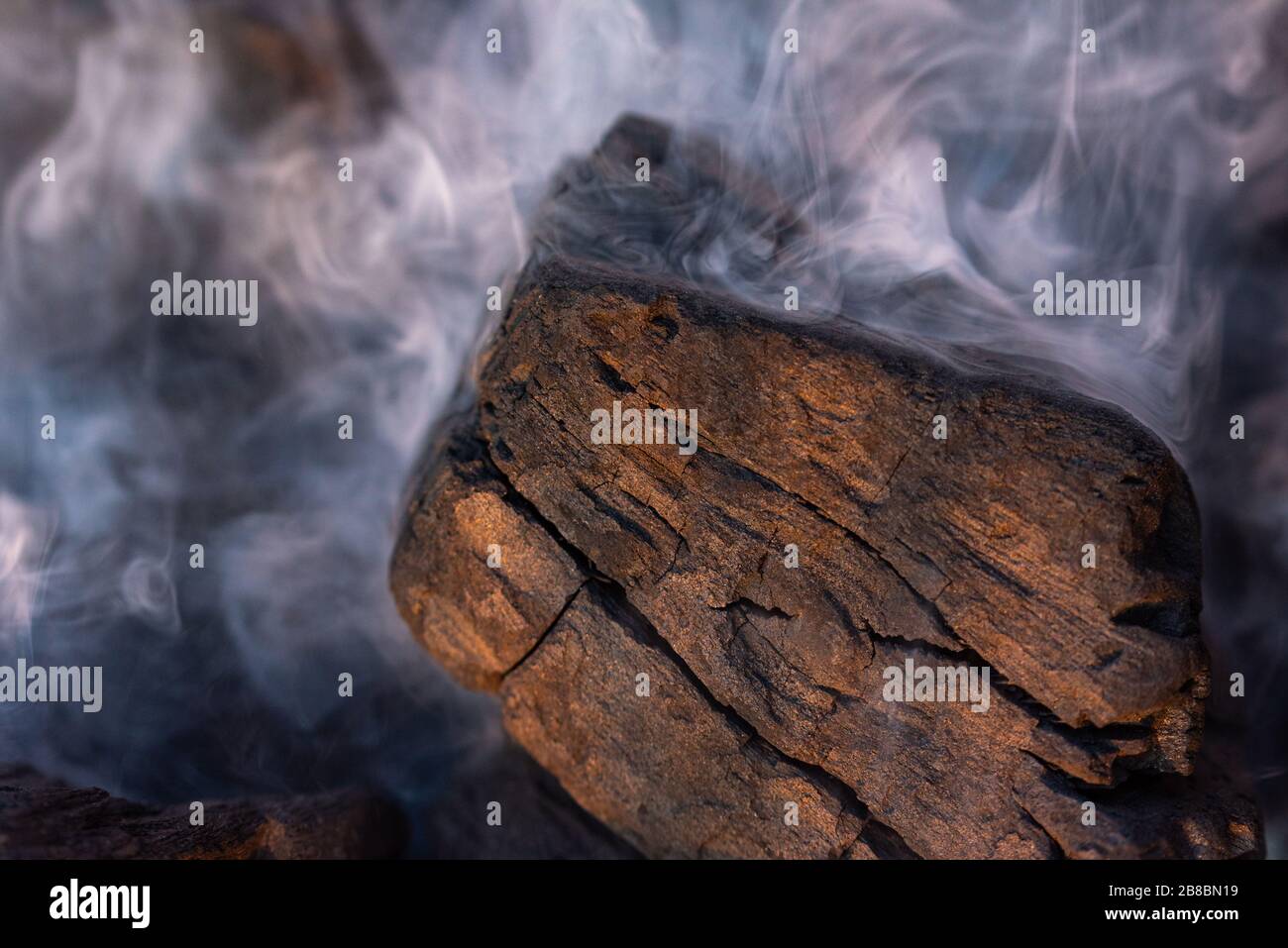 Coal in a cloud of smoke. Coal heating and environmental protection ...