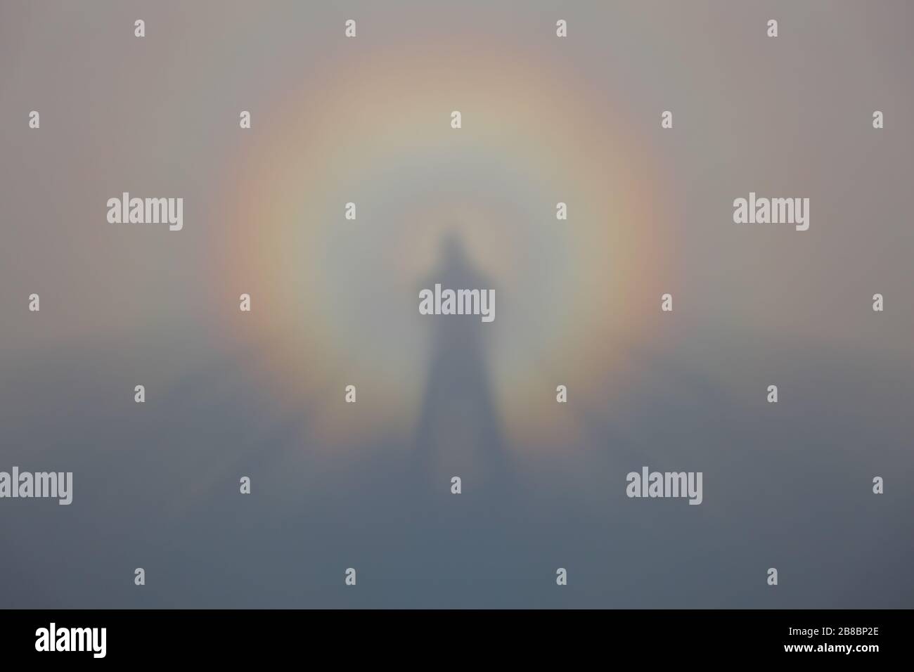 Rainbow shrouded silhouette of a human body reflected in mist Stock ...