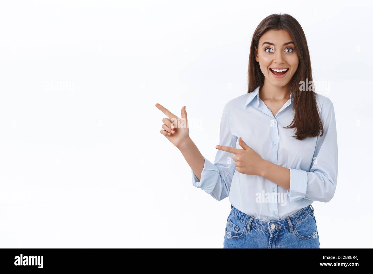 Surprised young successful working woman in blue blouse look impressed ...