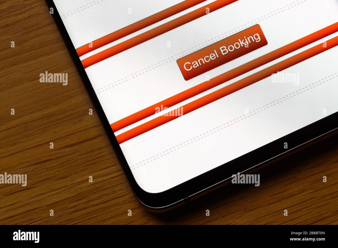 cancel booking text button on smart phone screen Stock Photo - Alamy