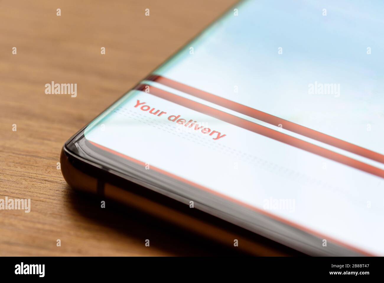 your delivery text on smart phone screen Stock Photo - Alamy