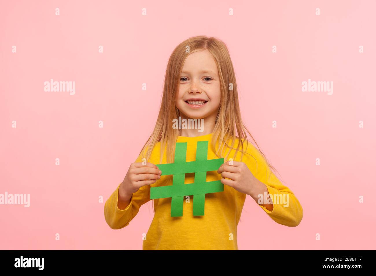 Popular kids content. Portrait of joyful cute adorable little girl ...