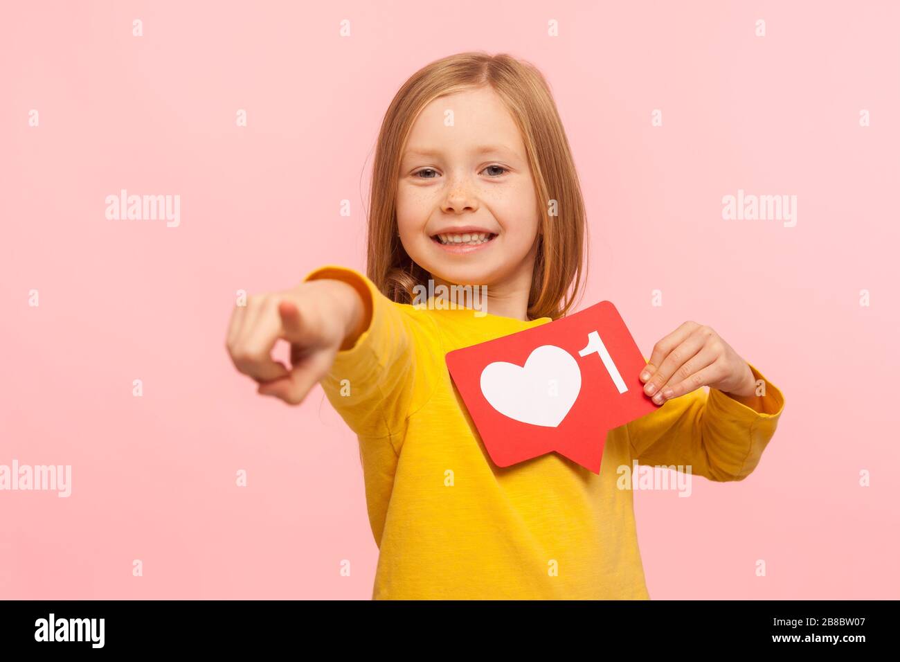 You push social media like button! Portrait of positive preschool girl ...