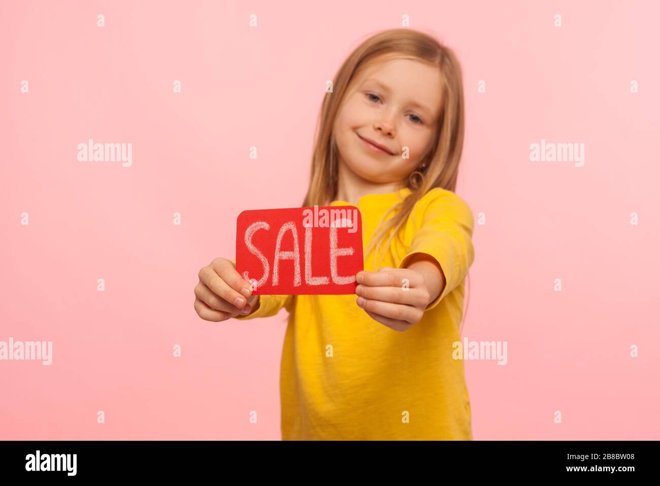 Weekend discounts! Excited cute happy little girl showing Sale ...
