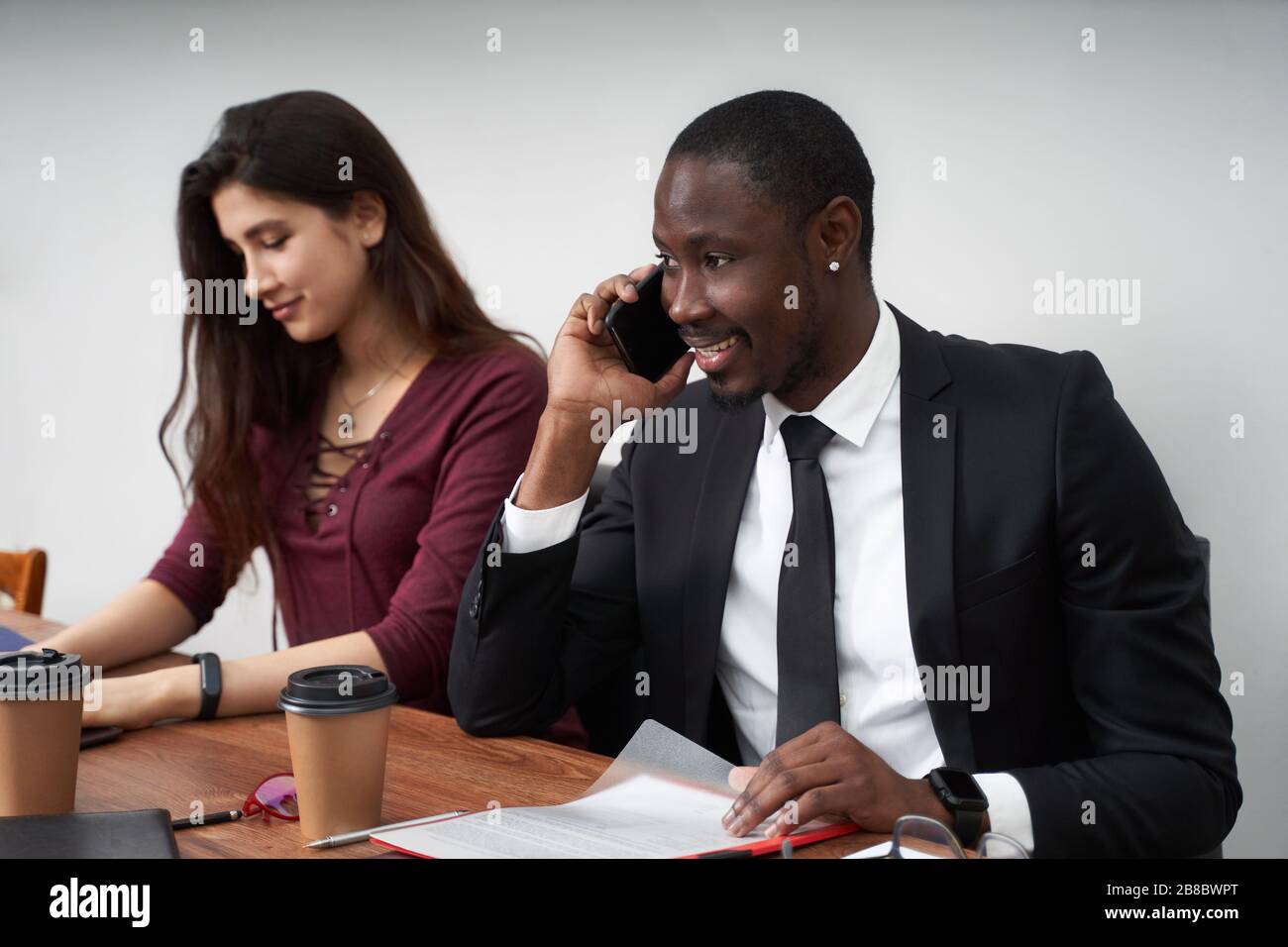 Young happy business people working together in modern office ...