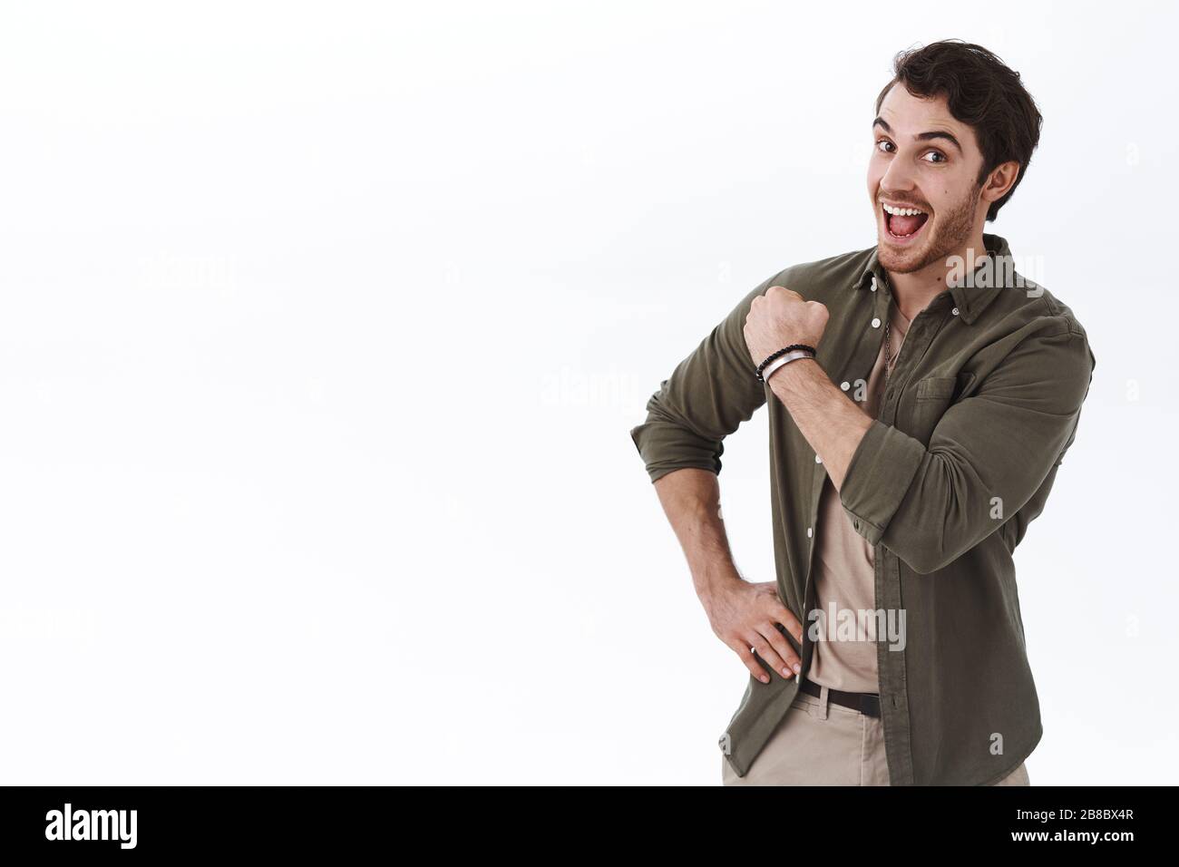 Optimistic happy and active young man encouraging keep going, fist pump ...